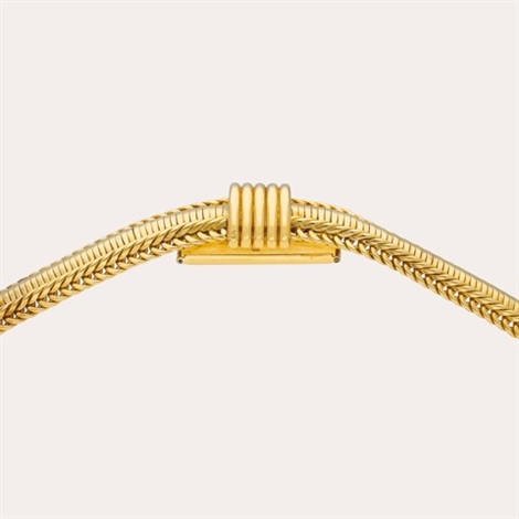 Cartier, A yellow gold bracelet watch with concealed dial, Circa 1965 卡 ...