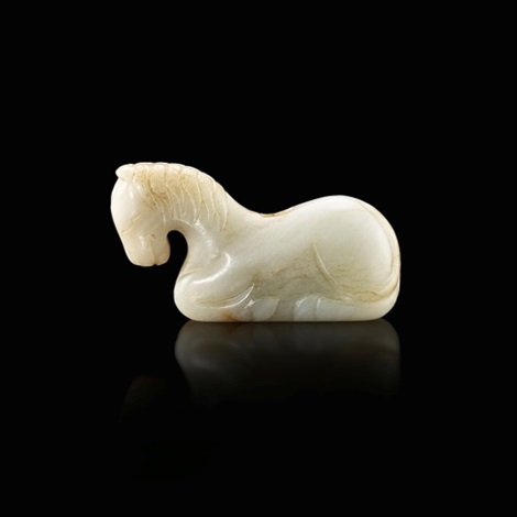 A white and russet jade recumbent horse, Six dynasties 六朝 白玉臥馬 on artnet