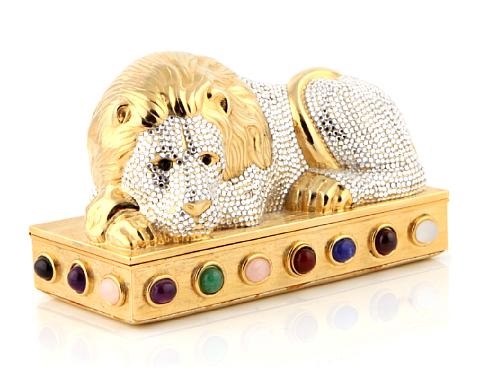 A laying down lion container by Judith Leiber on artnet