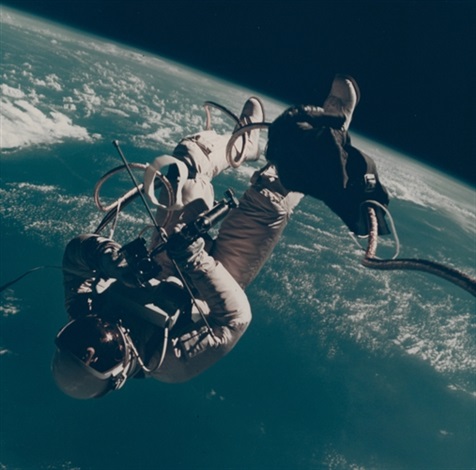 Gemini IV, Ed White taking the first photograph from outer space during the First US Space Walk ...